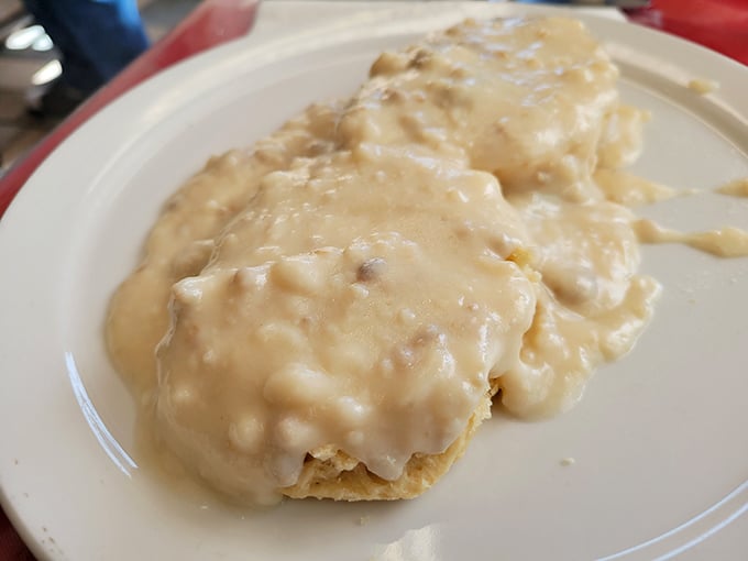 The star attraction doesn't disappoint—pillowy biscuits swimming in velvety sausage gravy. This isn't just breakfast; it's an edible hug for your soul.