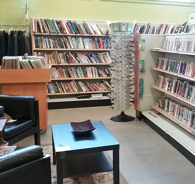 The literary corner: where paperbacks, hardcovers, and the occasional questionable 1970s cookbook create walls of words waiting for their next chapter.
