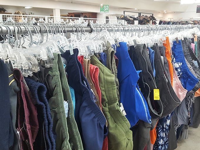 Men's clothing organized with military precision—proof that second-hand shopping doesn't mean sacrificing your dignity or your sense of style.