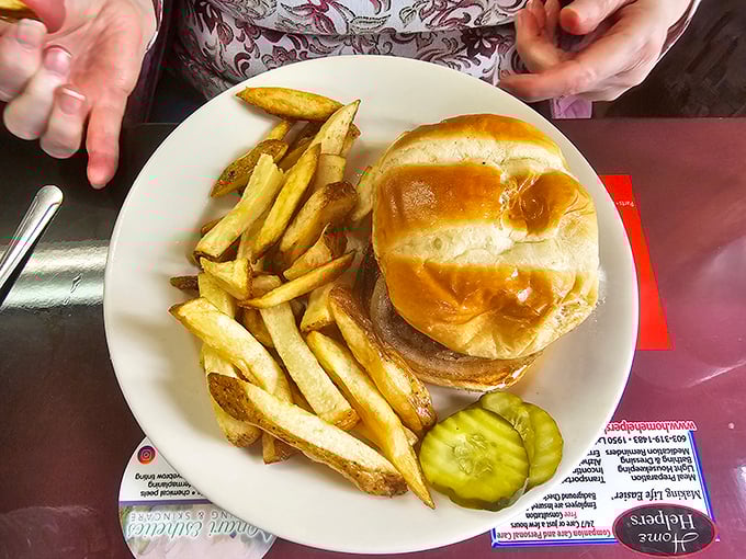 The burger and fries combo – proof that lunch at a breakfast joint isn't settling, it's strategic. That golden-brown potato perfection isn't an accident.