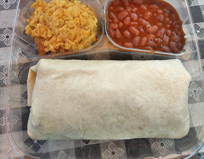 The pulled pork wrap – where BBQ meets convenience without sacrificing an ounce of flavor. Portable perfection with sides that refuse to be afterthoughts.