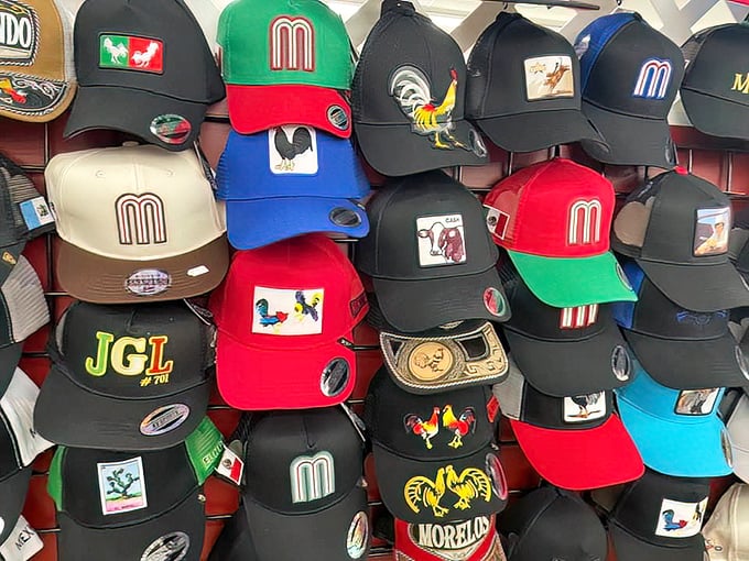 Hat heaven! These colorful caps with rooster emblems aren't just headwear—they're conversation starters perched atop metal racks.