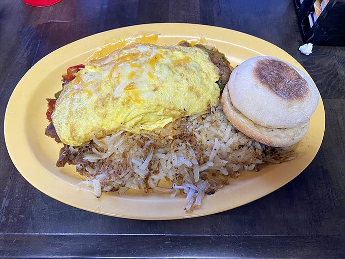 The cheesesteak omelet proves breakfast isn't just sweet talk—this savory masterpiece pairs perfectly with crispy hashbrowns and a biscuit sidekick.