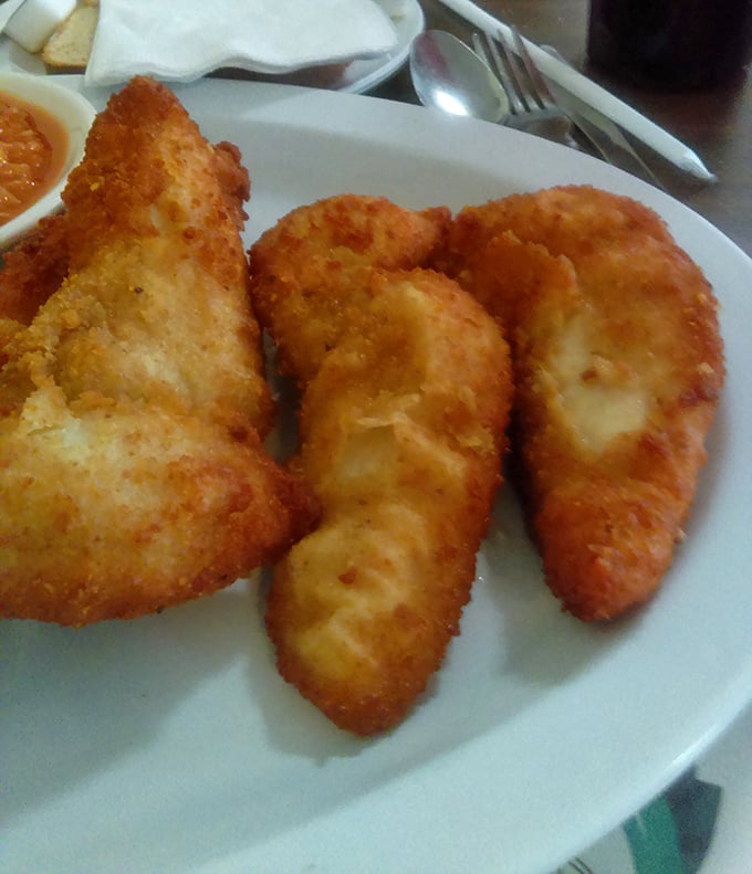 Chicken tenders that actually live up to their name—tender inside, crackling outside, and completely devoid of the freezer-to-fryer sadness found at chain restaurants.