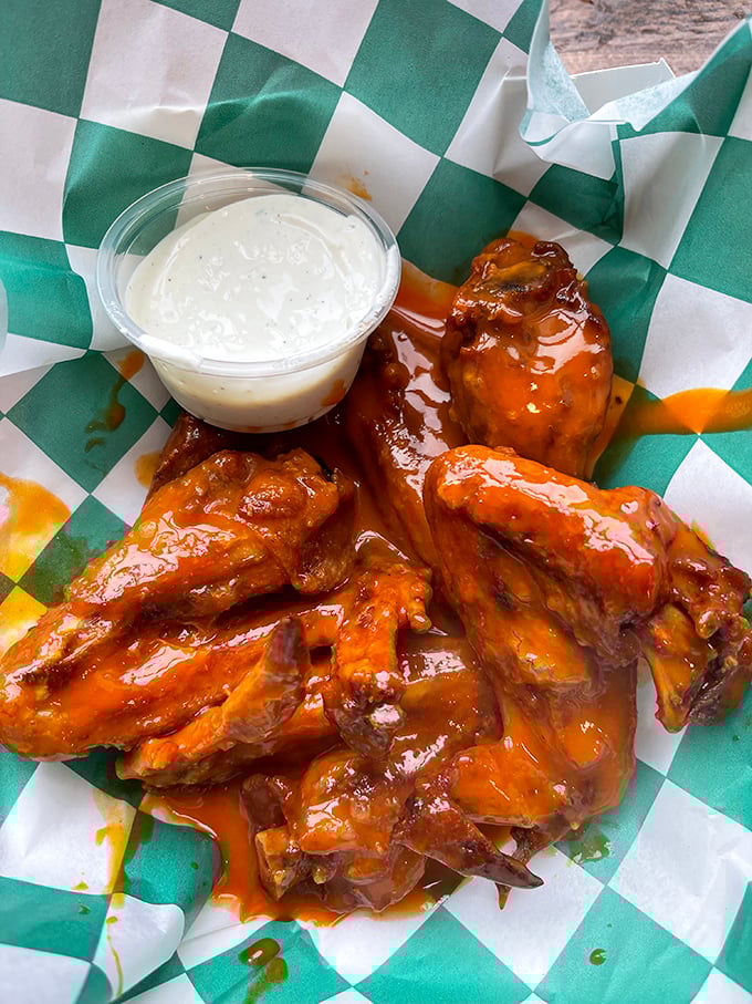 Buffalo wings so perfectly glazed they could be in a food museum. That blue cheese dip isn't just a condiment—it's a cooling lifeline.