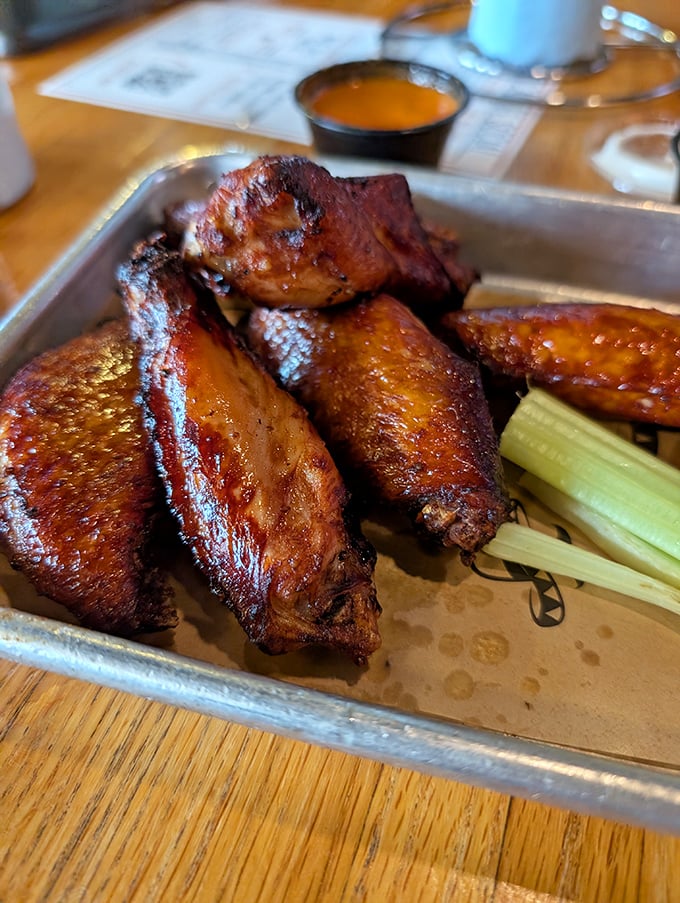 These wings aren't just cooked, they're transformed—glistening with sauce and promising the kind of flavor that makes conversation stop mid-sentence.