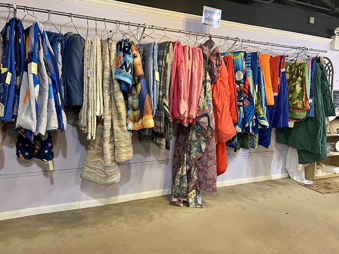 Comforters and textiles hanging like colorful flags of thrift nation. Each one tells a story you get to continue.
