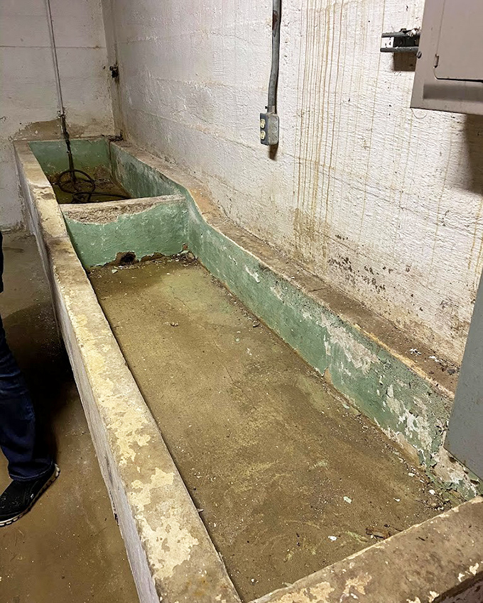 Institutional bathing at its most utilitarian. This concrete trough reminds us how far we've come in treating society's most vulnerable members.