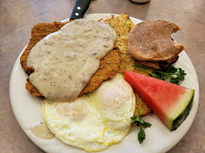 Country fried steak that could make a vegetarian weep with temptation—crispy exterior, tender interior, and gravy that should be classified as a controlled substance.