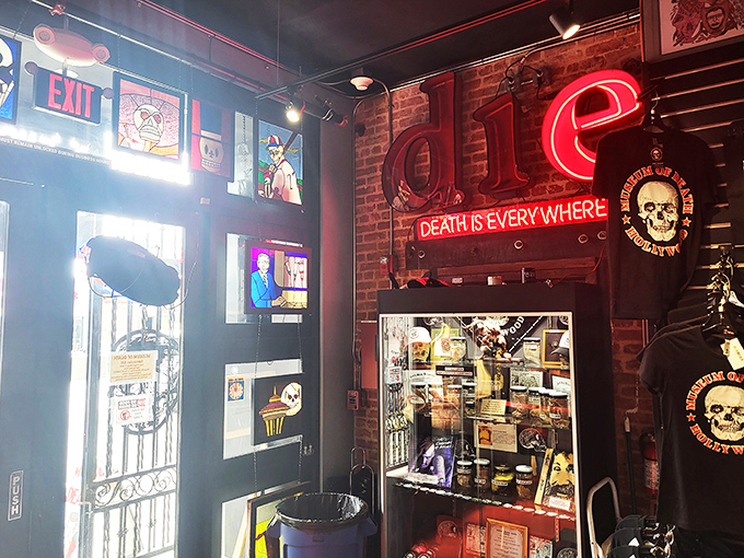 The gift shop's neon sign declares "Death is Everywhere," illuminating merchandise that walks the line between tasteful and tasteless.