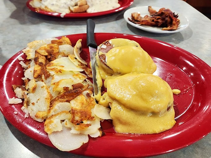 Eggs Benedict: where hollandaise dreams come true. Those home fries aren't just a side dish—they're an essential supporting character in this breakfast drama.