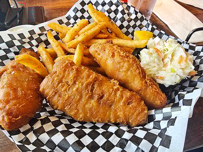 Fish and chips that would make a British pub jealous, served with a side of coleslaw that actually deserves to be eaten.