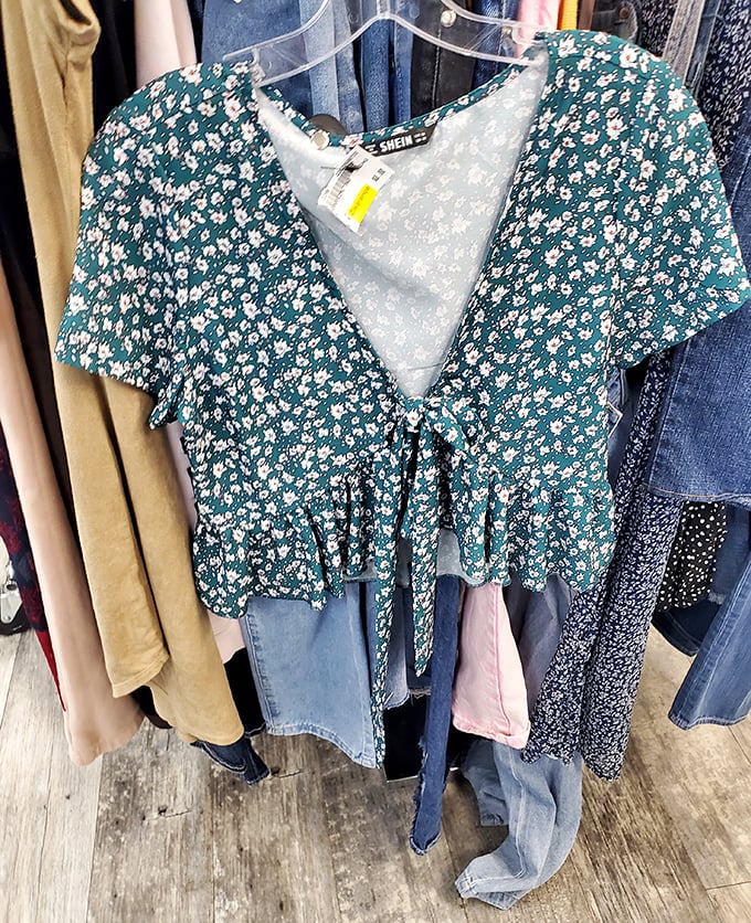 That floral top whispers "summer romance" while the price tag screams "budget victory." Fashion poetry in green and white.