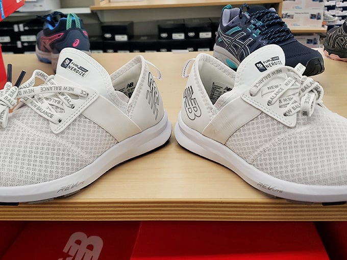 New Balance sneakers lined up like eager recruits—ready to cushion your steps through the remaining 74 stores without complaint.