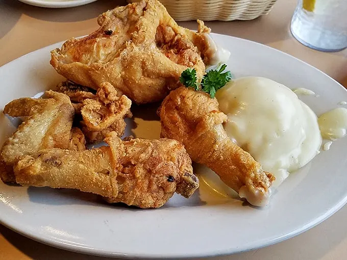 Fried chicken with a crust so perfectly golden and crisp, it makes you wonder if Colonel Sanders has been taking notes all these years.