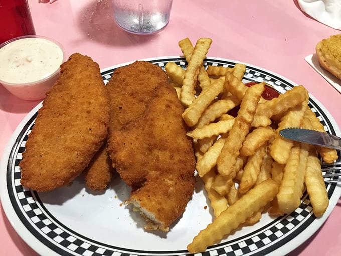 The golden-brown armor on this fried chicken doesn't just crunch—it serenades. Those crinkle-cut fries are the perfect backup singers.