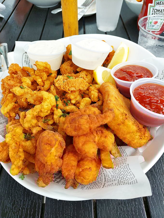 A seafood feast that would make Neptune himself jealous – golden-fried treasures from the deep, served with lemon wedges and dipping sauces.