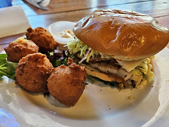 This grouper sandwich with golden hush puppies is the Florida equivalent of a royal feast—no crown required, just a healthy appetite.