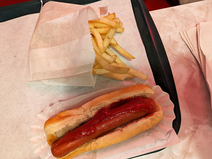The hot dog and fries combo—America's culinary love language, spoken fluently at Burky's with no pretension, just delicious execution.