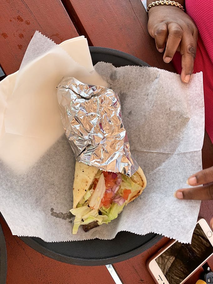 The legendary lamb gyro—where each bite delivers a Mediterranean vacation without the airfare. Fresh, vibrant, and worth every napkin you'll need.