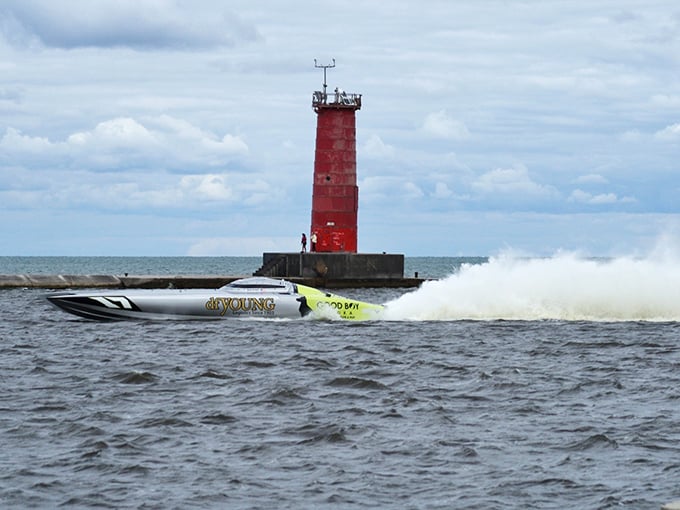 Speed meets serenity as a powerboat races past Sheboygan's iconic red lighthouse. Lake Michigan proving it can deliver adrenaline and picture-perfect moments simultaneously.