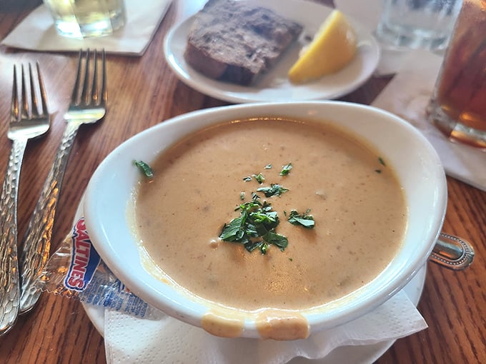 The legendary lobster bisque arrives—creamy, rich, and garnished with possibility. One spoonful and you'll understand why people cross county lines for it.