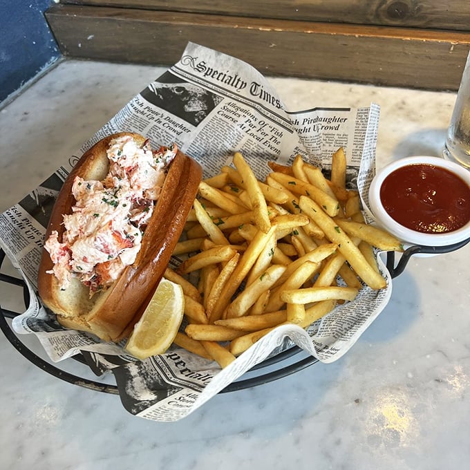 This lobster roll isn't messing around—chunky meat, minimal filler, and fries so perfect they deserve their own fan club.