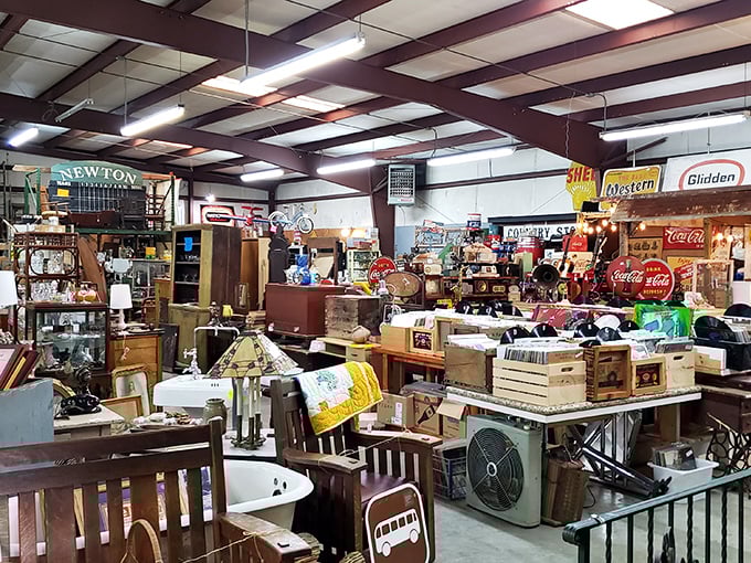 Navigate through aisles where vintage Coca-Cola signs hang above furniture treasures—like a department store designed by history buffs.