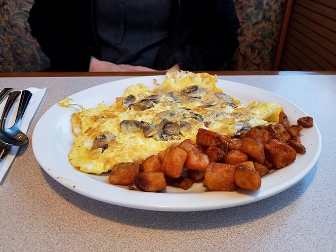 The star of the show: a mushroom omelet that's perfectly executed with golden edges, generous fillings, and those home fries that deserve their own fan club.
