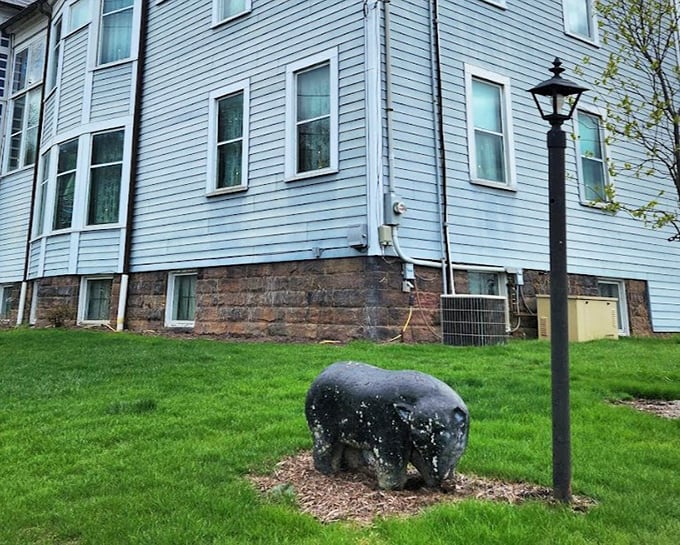The stone bear guards the mansion like a Victorian-era security system. Less effective than today's cameras, but infinitely more charming.