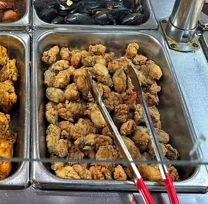 Golden-fried treasures await the hungry explorer. These crispy morsels are the buffet equivalent of striking oil – pure culinary gold.