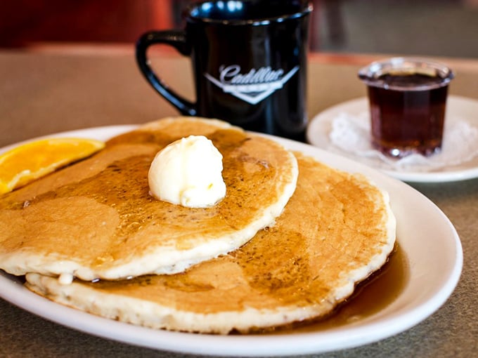 These pancakes aren't just breakfast, they're therapy—golden discs of comfort topped with a melting pat of butter that whispers, "Everything's gonna be okay."