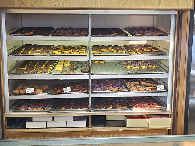The pastry case at Biagio's is like a museum of deliciousness—each shelf a different exhibit of why elastic waistbands were invented.