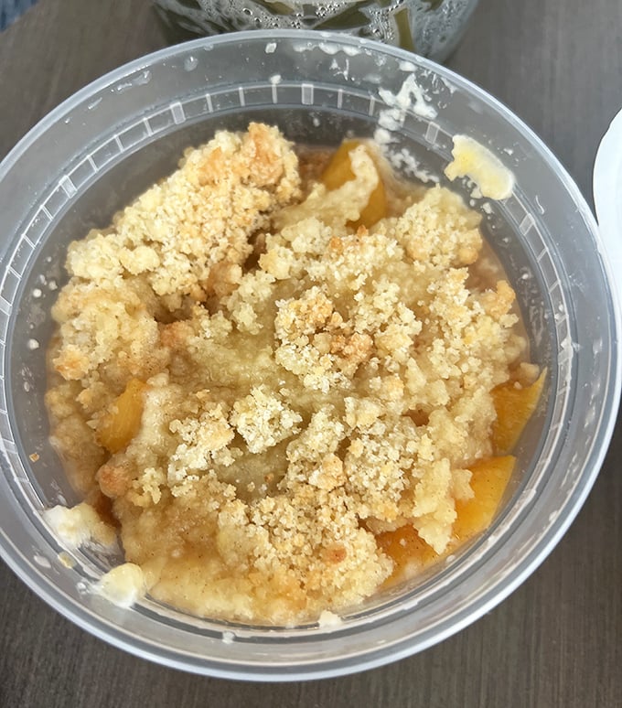 Not all heroes wear capes—some wear crumbly toppings. This peach cobbler is what dessert dreams are made of, sweet enough to make your dental hygienist wince.