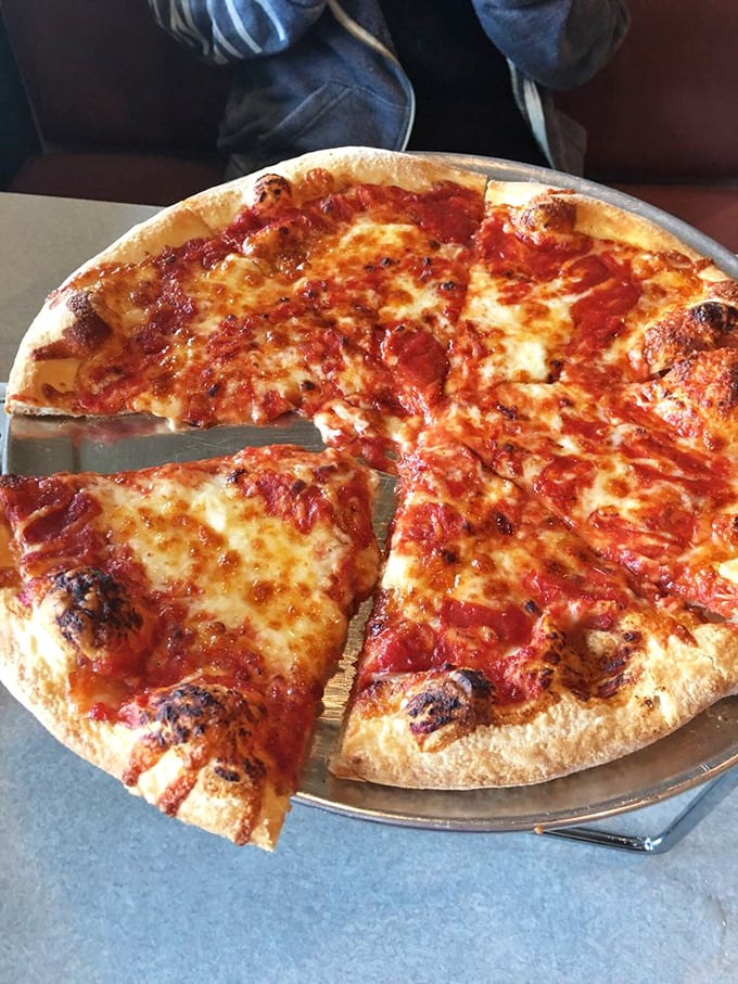 Pizza perfection isn't just about ingredients—it's about balance. This pie's crispy-yet-chewy crust and golden cheese spots are what dreams are made of.