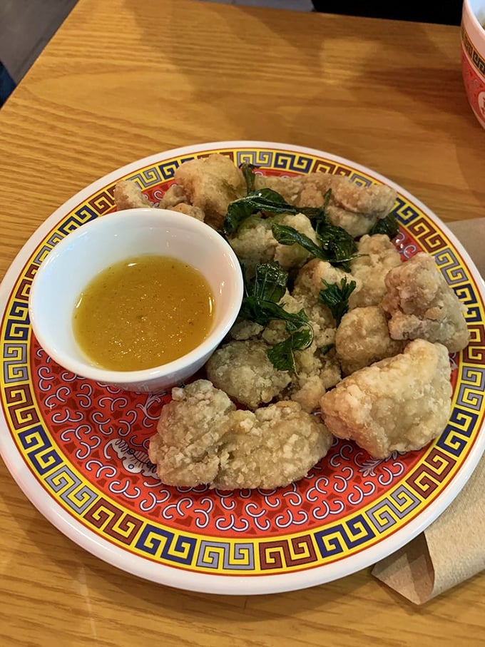 Golden, crispy popcorn chicken with basil that's actually crispy, not soggy—a rare and beautiful thing in this world.