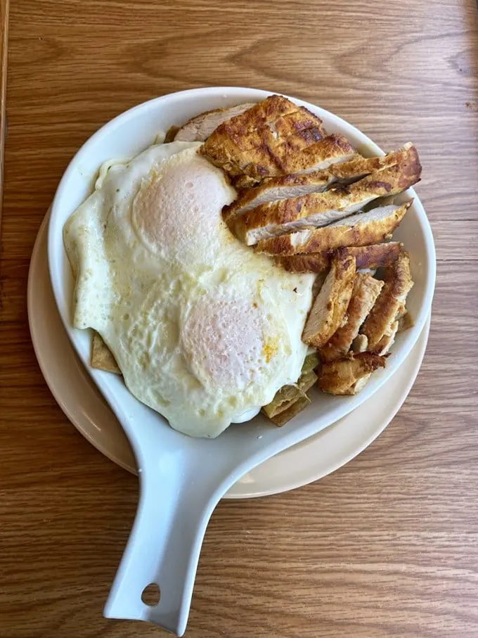 When a pork chop and eggs arrive on a skillet, it's not just breakfast—it's a declaration that today will be conquered.
