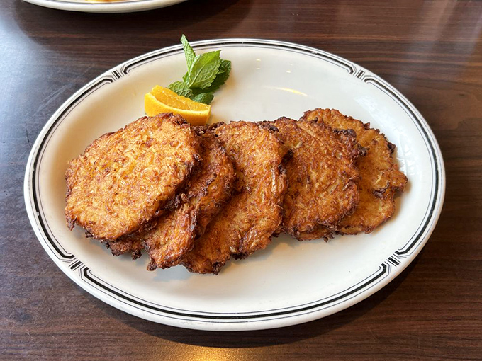 Golden-brown potato pancakes with crispy edges that crackle with each bite—a symphony of shredded potatoes that Mozart would envy.