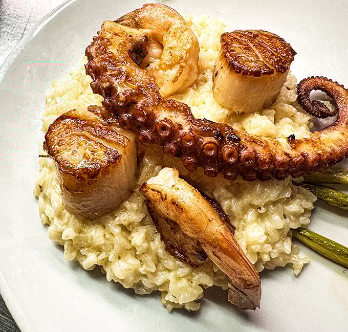 Seafood risotto that makes you question all other risottos you've ever known—creamy rice playing host to perfectly grilled ocean treasures.