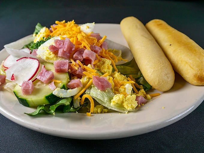 The chef's salad and breadsticks—what my doctor thinks I should be eating versus what I'm actually using to save room for more steak.