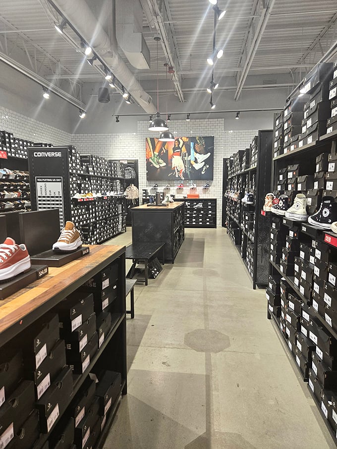 The Converse store isn't selling shoes—it's selling nostalgia with modern upgrades. That wall of Chuck Taylors is like a timeline of American casual fashion.