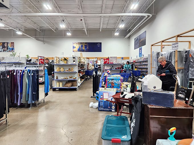 Between housewares and clothing, shoppers navigate the thrill of the hunt. That blue bin might contain someone's castoff—or your next kitchen essential.