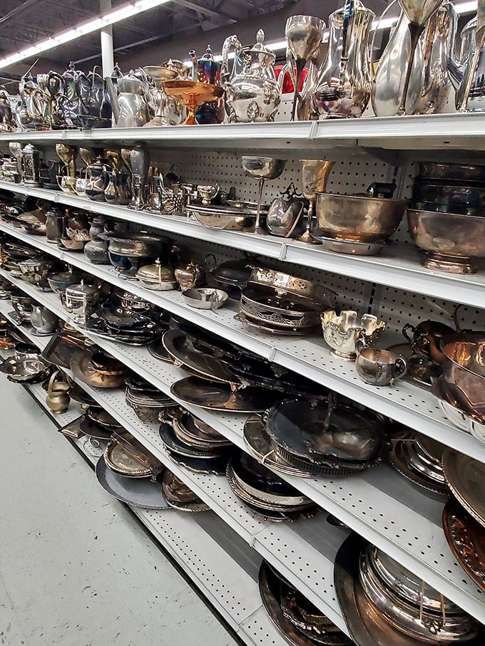 Silver treasures gleam under fluorescent lights—wedding gifts from decades past now ready for new celebrations in homes that appreciate vintage charm.