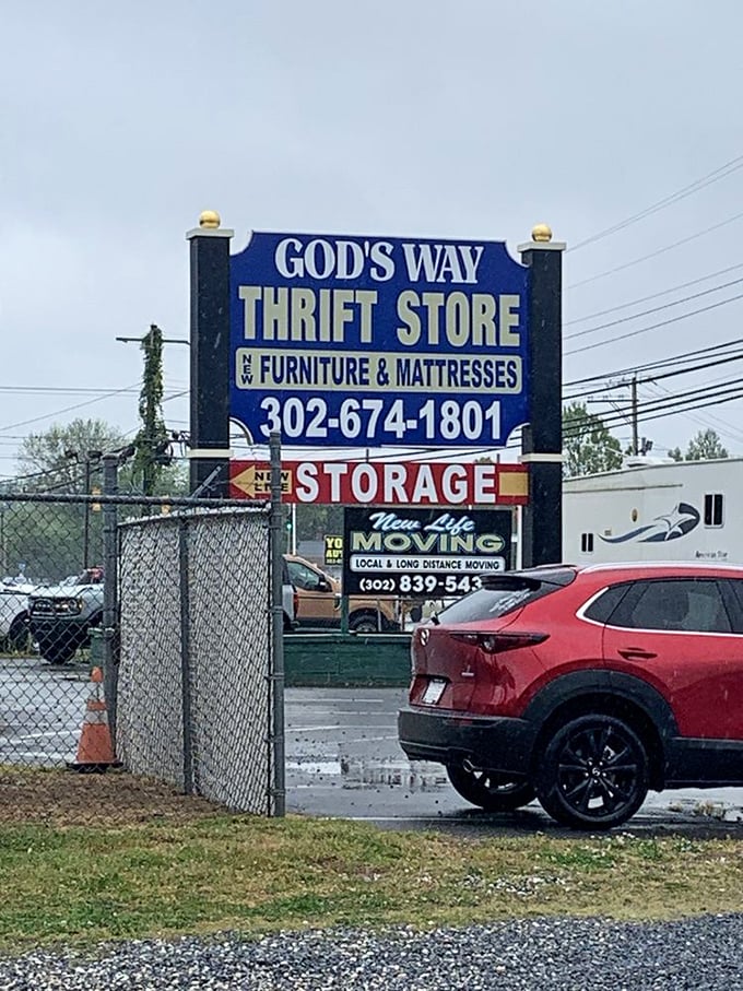 The roadside sign proudly announces not just a thrift store, but a furniture destination—a beacon for budget-conscious decorators.