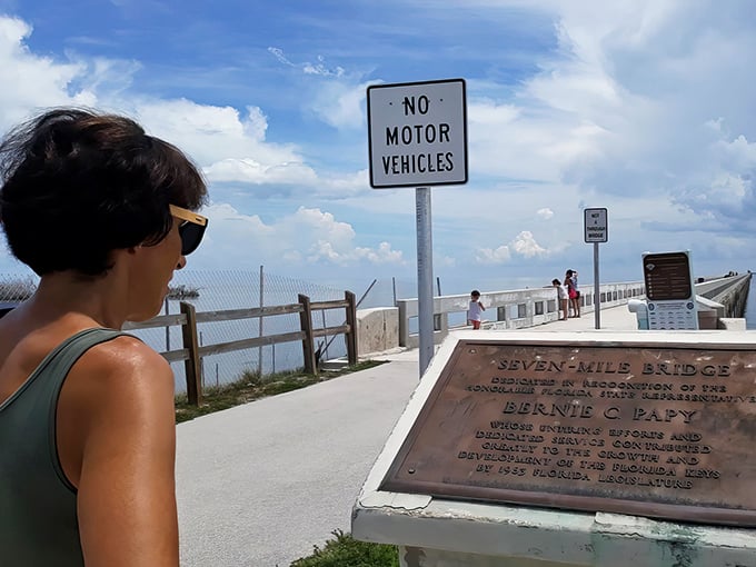 History lessons with a view. The old Seven Mile Bridge plaque offers context, but let's be honest—you're here for that spectacular backdrop.