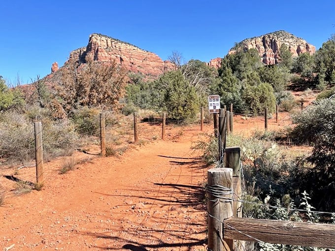 Follow the rustic fence to wonderland. This trail doesn't need neon signs or billboards—its beauty speaks in whispers that carry for miles.