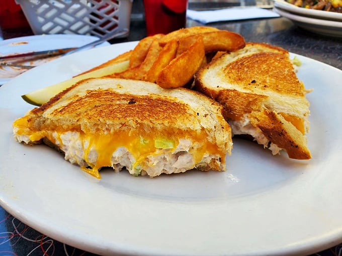 The humble tuna melt—elevated to art form. That golden-brown exterior gives way to a gooey cheese center that makes Monday feel like Friday.