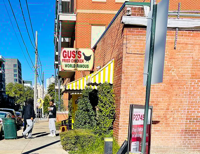 Gus's yellow-striped awning stands out like their chicken does – bold, distinctive, and impossible to ignore.