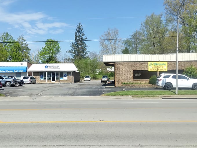 A quiet stretch of Liberty’s main road, where tacos and tax help share the same parking lot.
