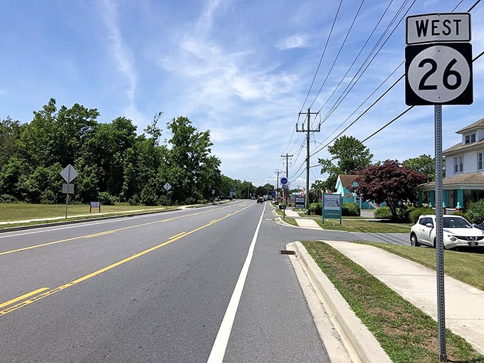 Route 26 stretches toward possibilities, where suburban comfort meets coastal dreams in perfect balance.